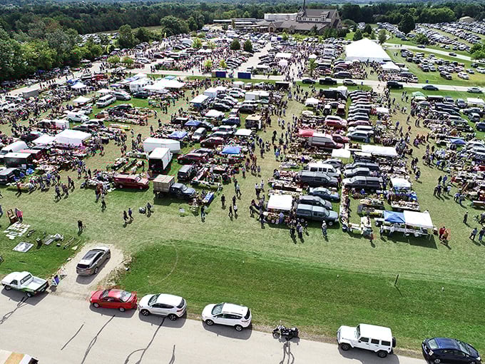 Under white tents, vendors create mini-neighborhoods where every table holds potential magic discoveries.