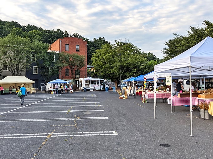 Historic brick buildings frame this charming market scene like a Norman Rockwell painting come alive.
