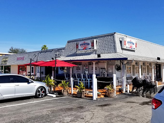 Twisted Lobster's weathered exterior is like that old fishing hat – not pretty, but full of seafood success stories.