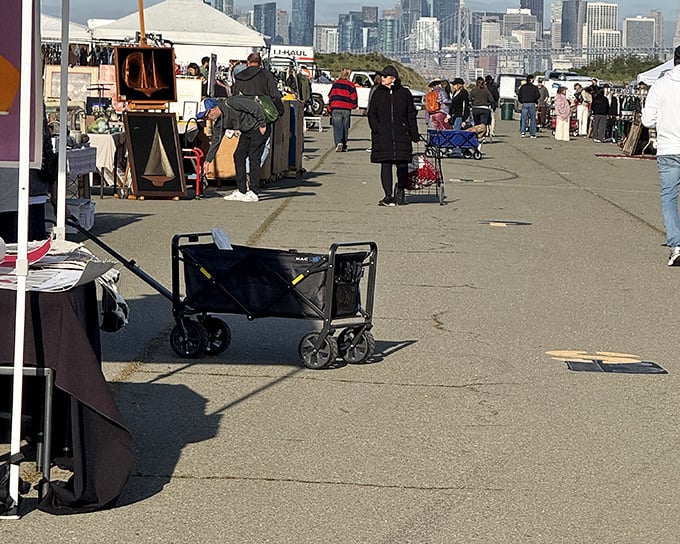 San Francisco skyline provides the perfect backdrop for wagon-pulling treasure hunters at Alameda Point, where the city watches over vintage voyagers.