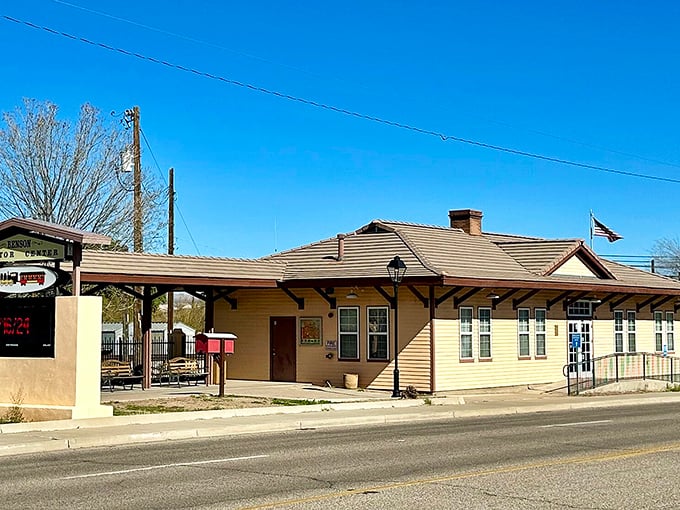 The Benson Visitor Center welcomes penny-pinchers with open arms and a fluttering flag, promising affordable adventures under that impossibly blue desert sky.