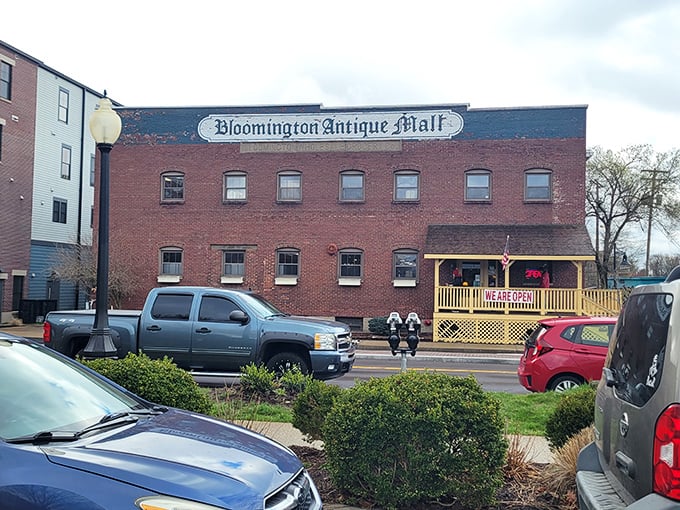 The brick facade tells one story, but those "We Are Open" signs tell the better one—treasures await inside this historic building.