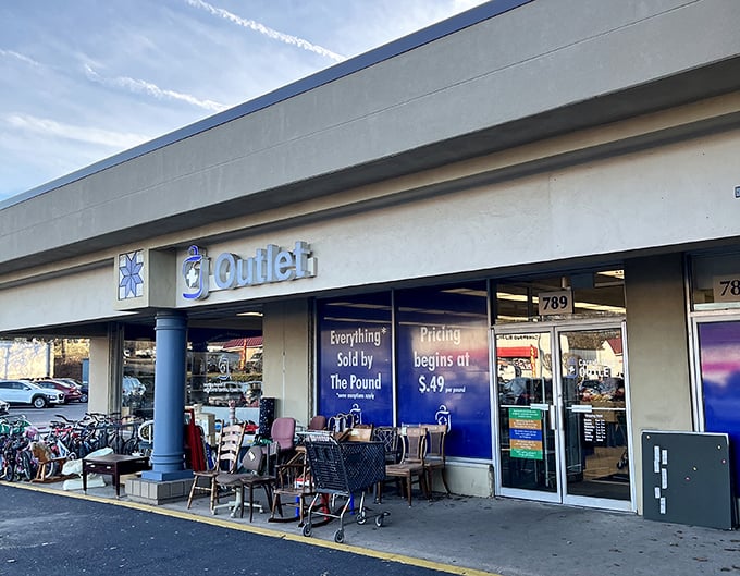 Blue skies and blue signs—a perfect match at Care & Share's storefront. Their per-pound pricing system turns shopping into a delightful game show.