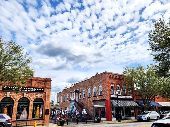 Fluffy clouds hover over Conway's charming brick buildings. This is small-town South Carolina at its picturesque best.