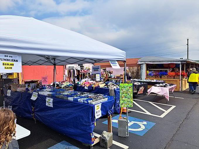 Pop-up tents and tables spill across the parking lot at Great Smokies Flea Market, turning everyday asphalt into an open-air treasure hunt.