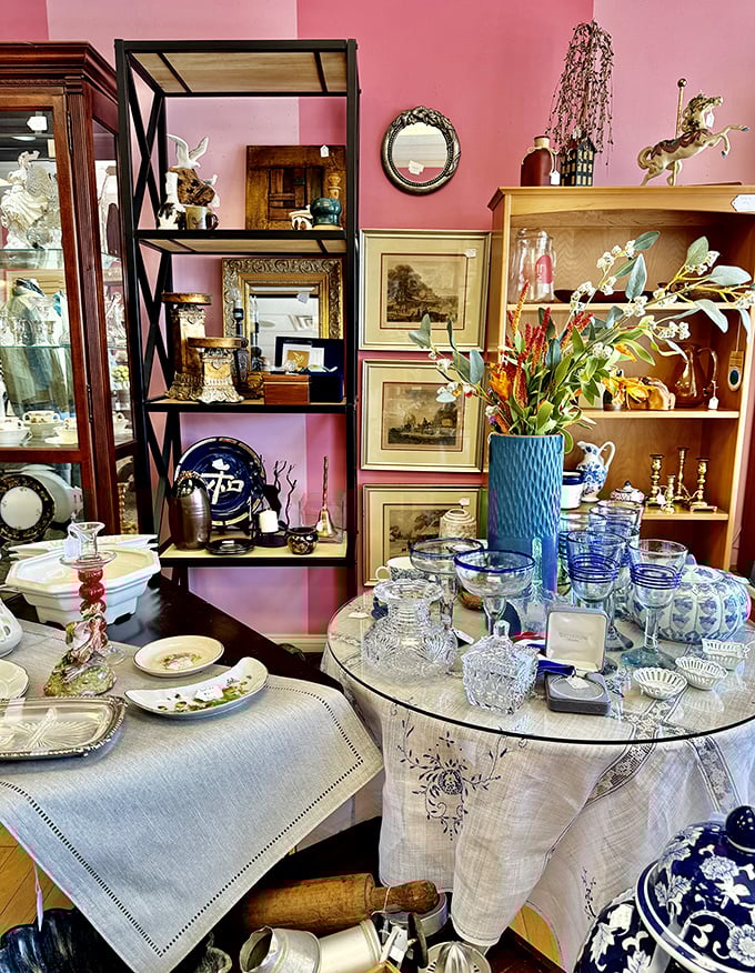 Pink walls and vintage treasures create a shopping atmosphere that feels like browsing grandma's favorite antique parlor.
