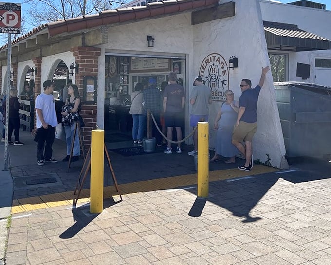 The universal language of barbecue: patient folks waiting for ribs that'll change their whole day.