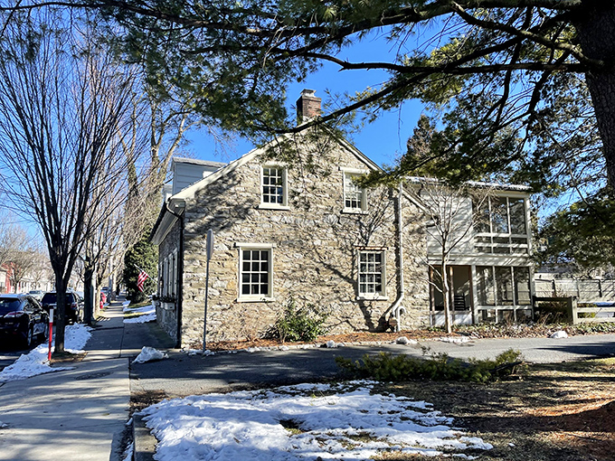 Winter's kiss on Lititz stone—where history hibernates under a dusting of snow while waiting for spring's gentle awakening.