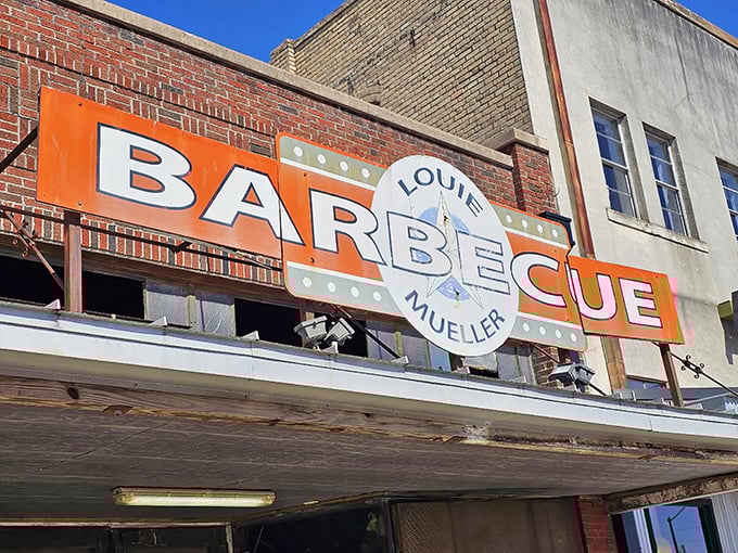That orange "BARBECUE" sign isn't just advertising—it's a beacon of hope for hungry travelers on Texas highways.