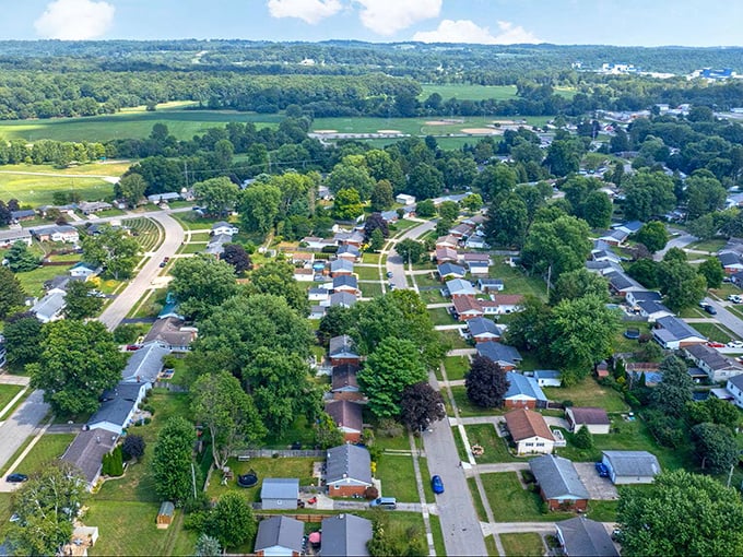 Rolling hills embrace Mansfield's neighborhoods like a warm hug, where every house tells a story of comfortable living.