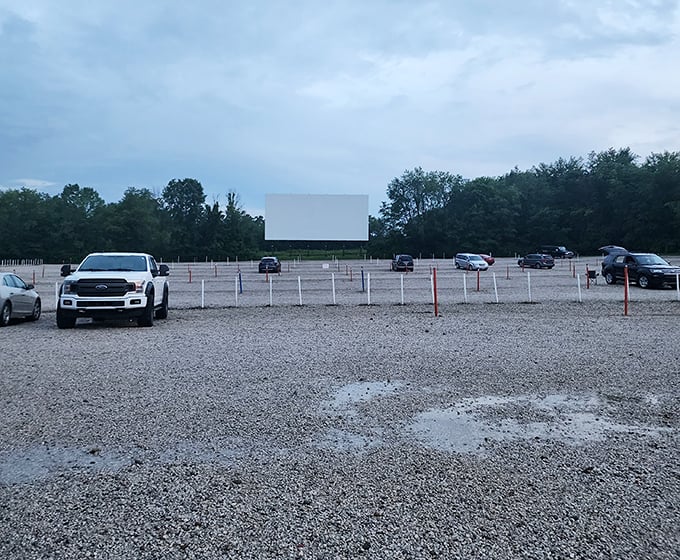 Gravel paths lead to movie magic where every parking spot offers front-row entertainment value.