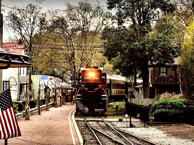 A vintage train rolls into New Hope’s station, where brick walkways, historic charm, and small-town warmth welcome travelers.
