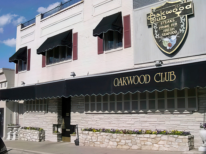 Classic white brick and black awnings – the Oakwood Club dresses better than most of its customers, and we're okay with that.