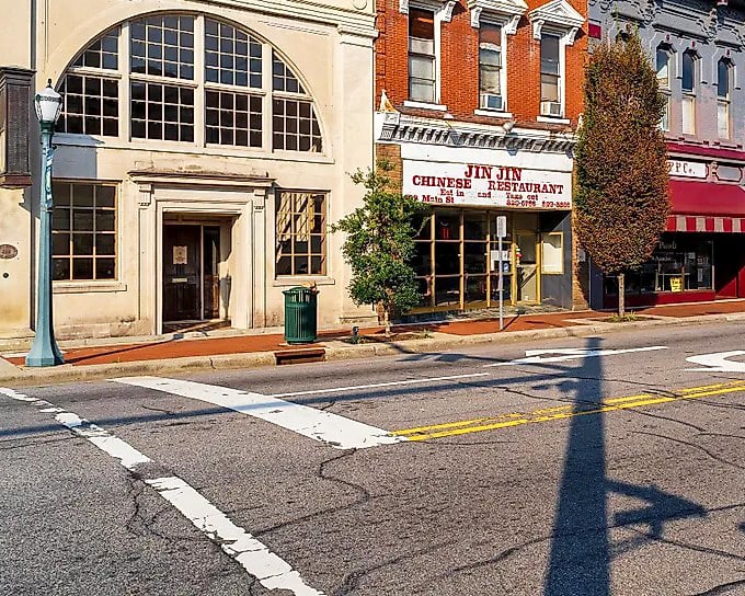 Tree-lined avenues create natural canopies over sidewalks where time moves at a comfortable, unhurried pace.
