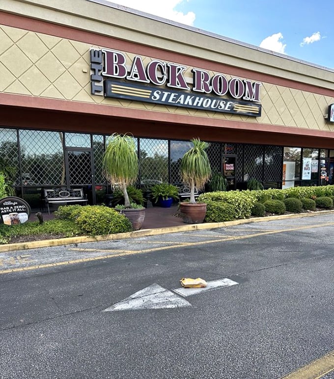 Those benches outside aren't for waiting—they're for recovering after your meal! The Back Room's modern exterior hides old-school steak expertise within.
