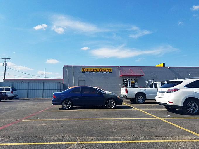 Parking lot full, wallets soon empty. Thrift Giant's unassuming exterior hides a labyrinth of second-hand treasures.