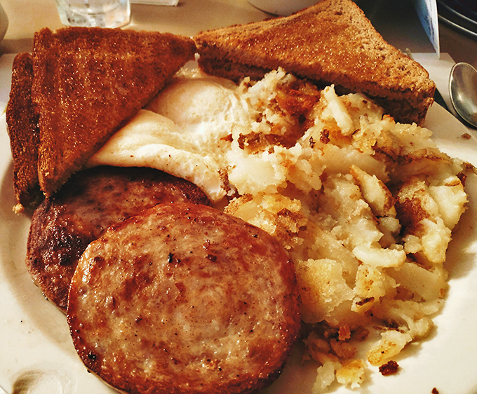 This breakfast plate isn't trying to impress Instagram – it's trying to impress your taste buds, and succeeding magnificently at that noble mission.