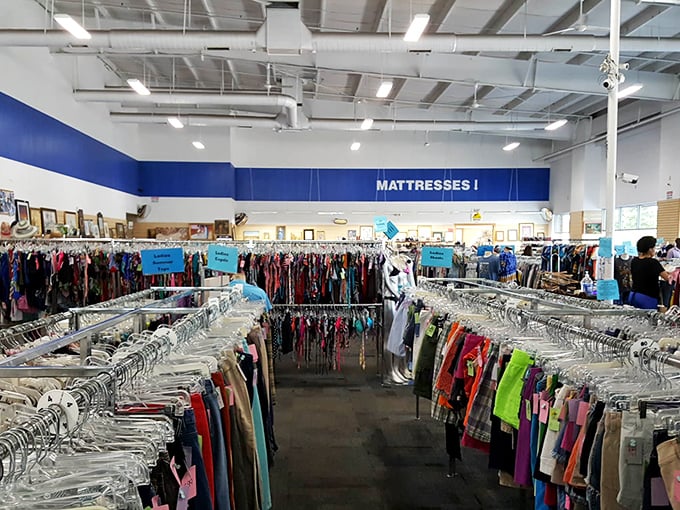 The women's section stretches toward the horizon like a technicolor sea. Marie Kondo would approve of this joyful organization system.