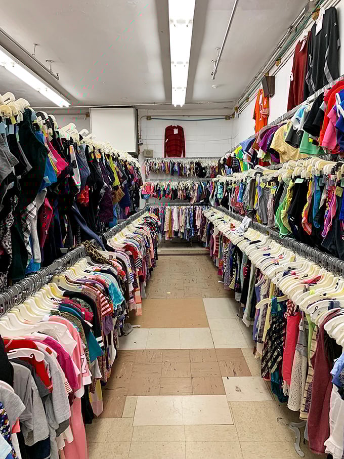 Rainbow corridors of clothing create a kaleidoscope effect that's both overwhelming and oddly satisfying—like Netflix's entire catalog suddenly materialized in fabric form.
