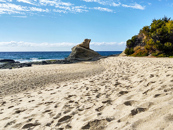 At Aliso Beach, that distinctive rock formation isn't just nature's sculpture—it's been photobombing family vacation pictures for generations.