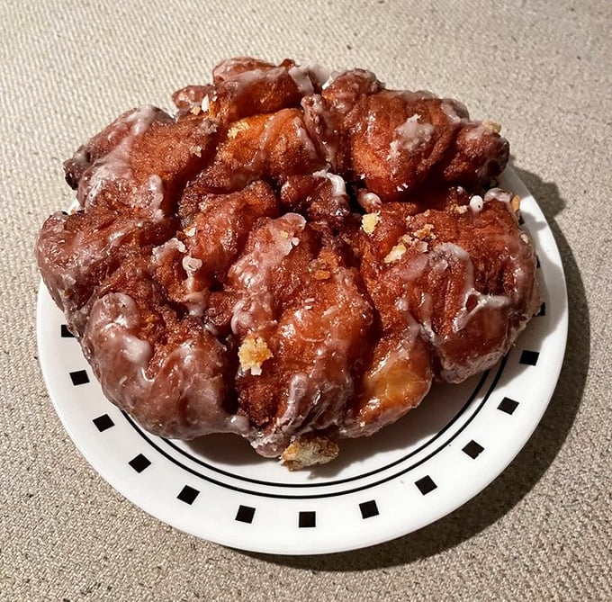 The apple fritter at Bob's is what other fritters dream of becoming – a craggy masterpiece of caramelized edges and apple-studded glory.