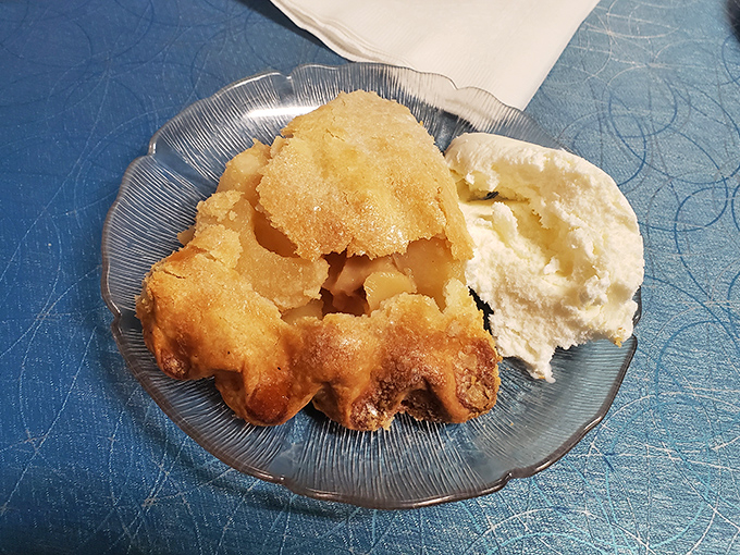 This isn't just apple pie – it's edible nostalgia with a side of ice cream. The golden crust practically whispers sweet nothings to your fork.