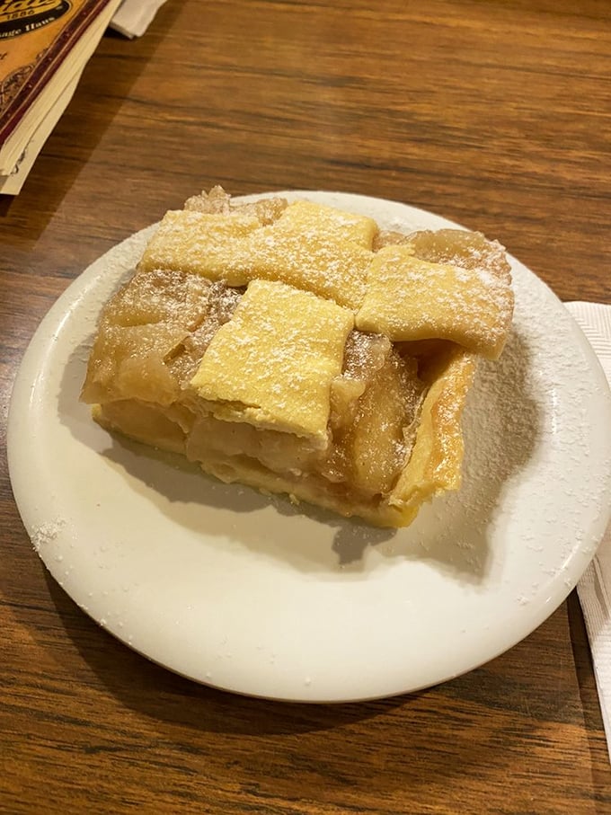 Layers of delicate pastry dusted with powdered sugar—this apple strudel isn't just dessert, it's architecture you can eat.