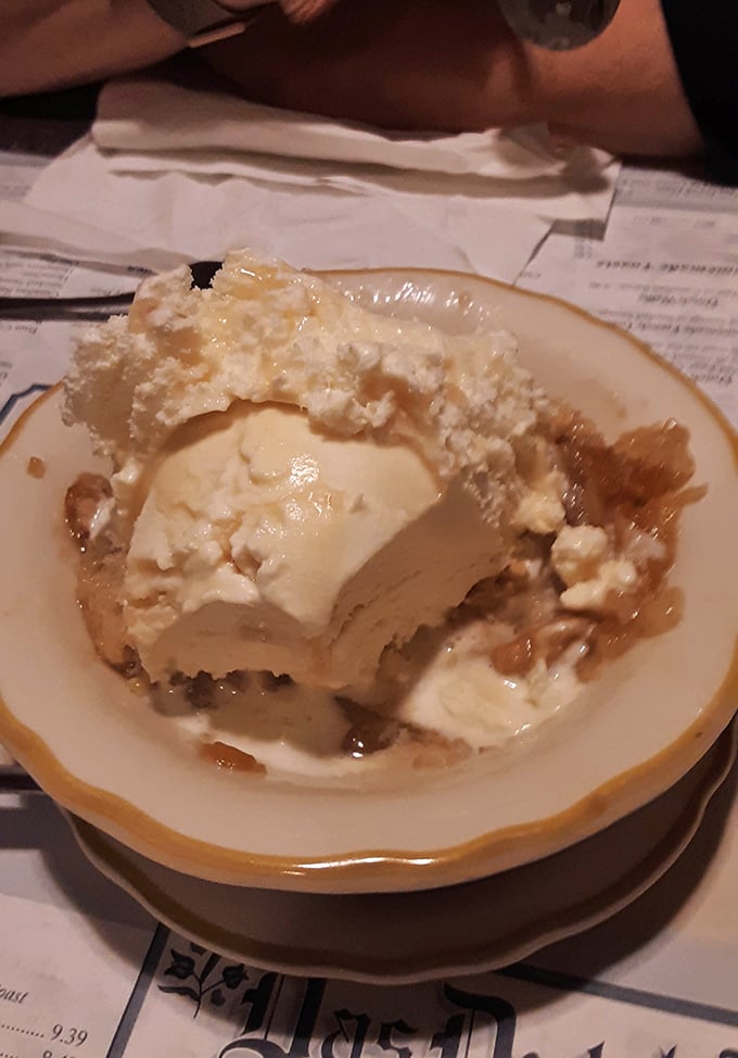 The legendary apple dumpling in all its glory—ice cream melting into warm pastry like it's found its soulmate after years of searching.