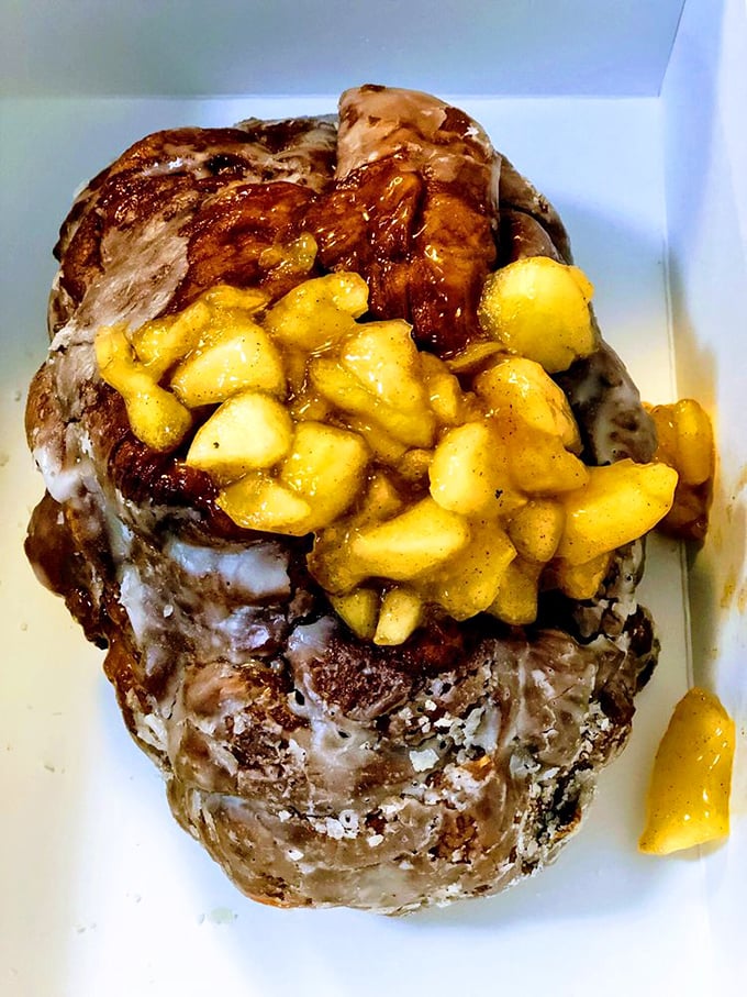Behold the legendary apple fritter—a glorious mountain of glazed, apple-studded pastry. This isn't just a donut; it's architecture with cinnamon.