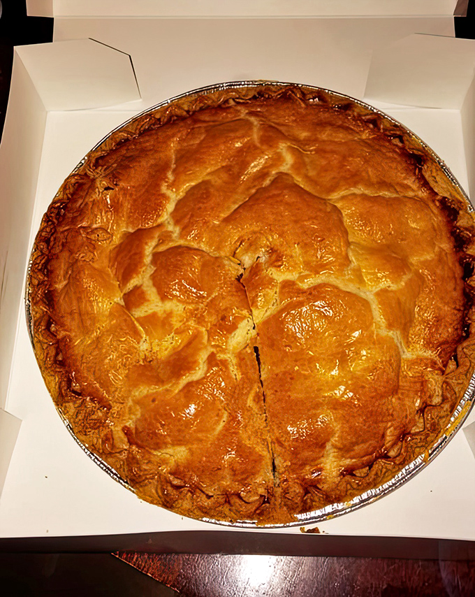 Behold the star attraction – a golden-domed apple pie with a crust so flaky it should be in the Pastry Hall of Fame.