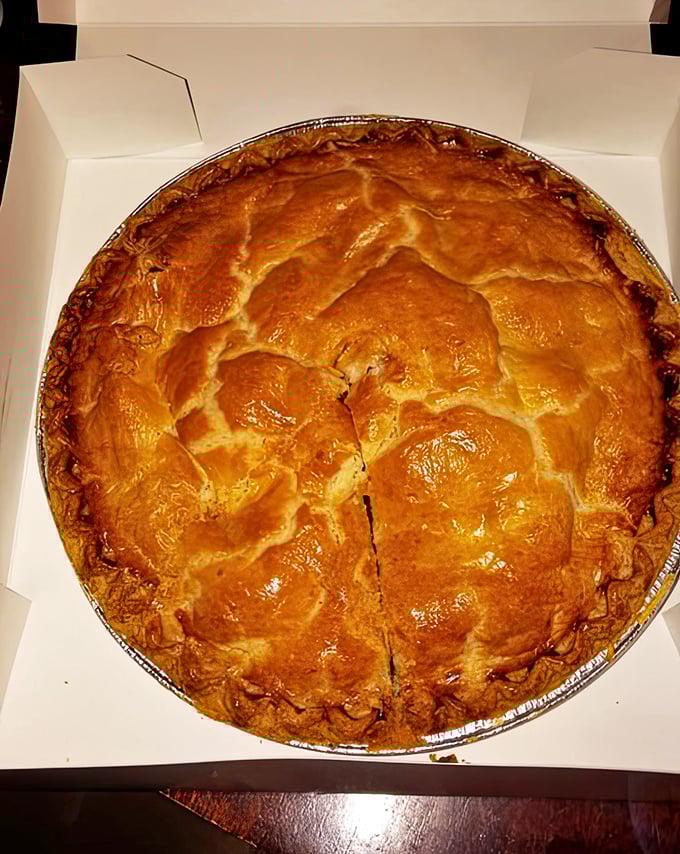 Behold the star attraction – a golden-domed apple pie with a crust so flaky it should be in the Pastry Hall of Fame.