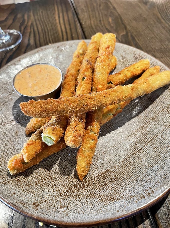 Behold the legendary asparagus fries – golden, crispy soldiers standing at attention, ready to convert even the most dedicated vegetable skeptics.