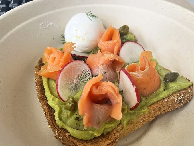 The star of the show! Avocado Lox Toast that's practically posing for its glamour shot, with that poached egg ready for its close-up.