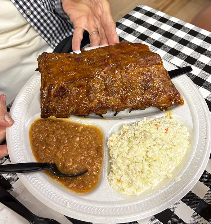 Behold the rib plate in all its glory—where Brunswick stew and coleslaw aren't mere sides, they're supporting actors in a meaty masterpiece.