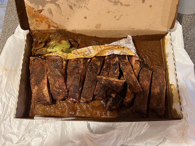 These ribs aren't just falling off the bone—they're practically jumping into your mouth, swimming in that signature sauce that's worth the trip alone.
