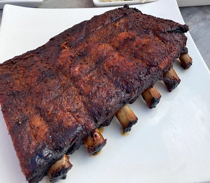 These St. Louis pork ribs aren't just cooked—they're transformed into meat candy with a bark so perfect it deserves its own appreciation society.