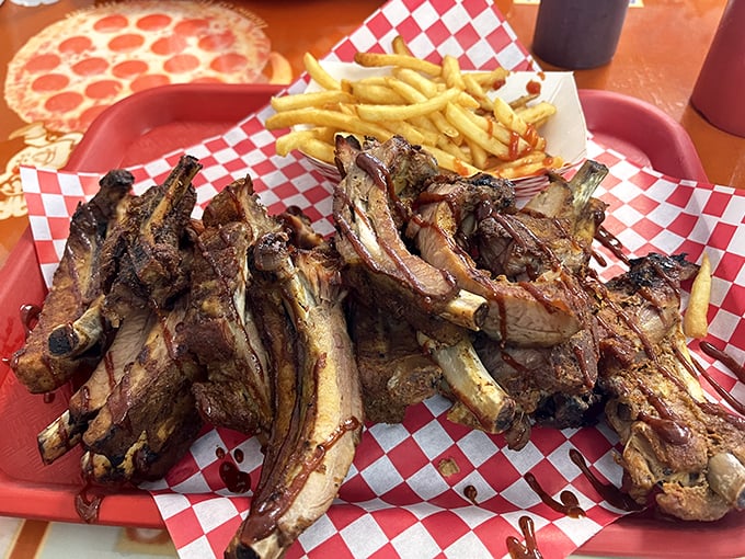 These ribs aren't just falling off the bone—they're practically filing for independence. The smoke ring tells the whole delicious story.