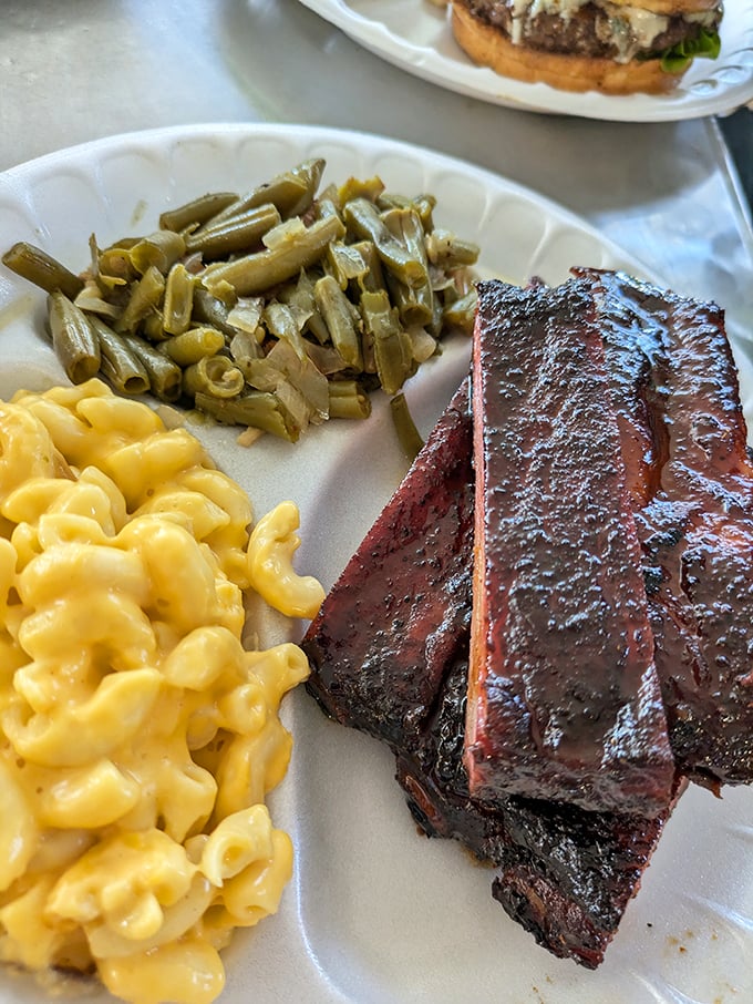 These ribs don't just fall off the bone – they practically leap onto your fork. Paired with creamy mac and cheese and green beans, it's comfort food elevated to art.