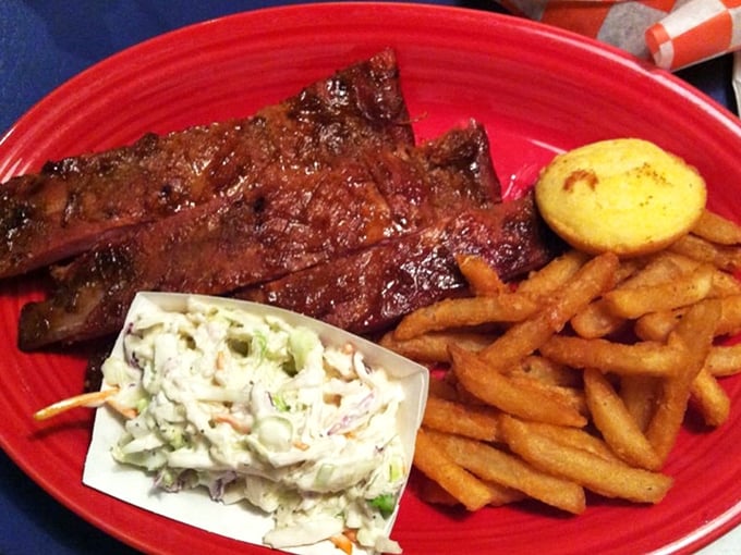 Ribs with that perfect mahogany bark, coleslaw for tang, and golden fries. This isn't just dinner—it's edible architecture built for maximum pleasure.