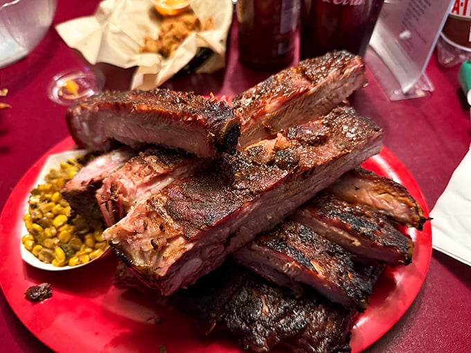 Behold the star of the show—ribs with that perfect pink smoke ring and beautiful bark. This isn't just dinner; it's edible architecture built by patient pit masters.