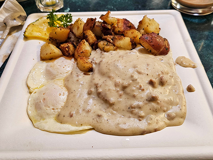 Biscuits and gravy that would make your cardiologist wince and your taste buds sing. Worth every heavenly, peppery calorie.