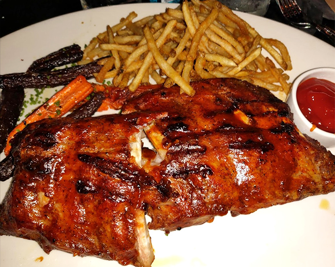 These baby back ribs don't need a jingle – their glistening, caramelized exterior and fall-off-the-bone tenderness sing for themselves.
