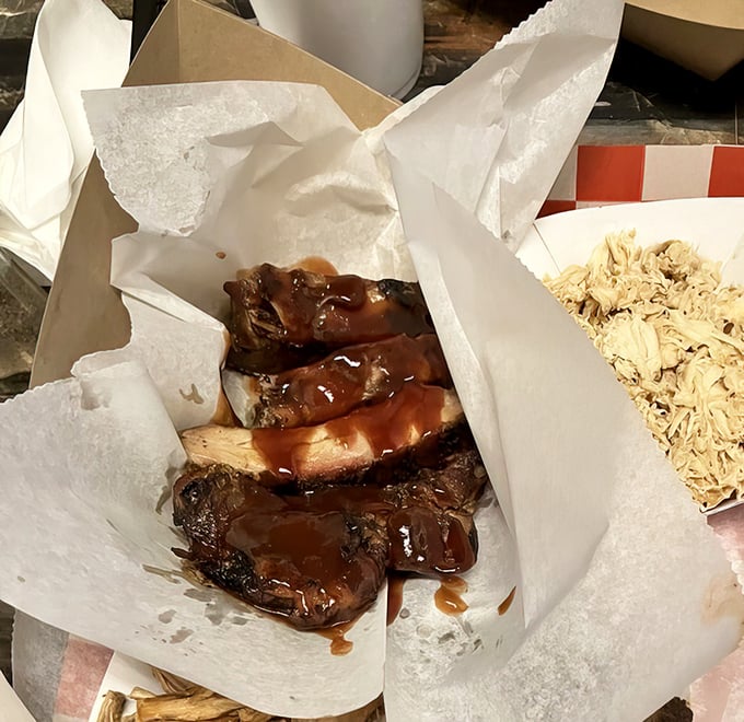 These ribs don't just fall off the bone—they practically leap into your mouth with smoky, saucy enthusiasm. Napkins required, regrets impossible.