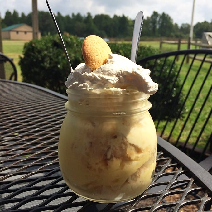 The holy grail—banana pudding served in a mason jar with a vanilla wafer crown. This isn't dessert; it's a religious experience with a spoon.