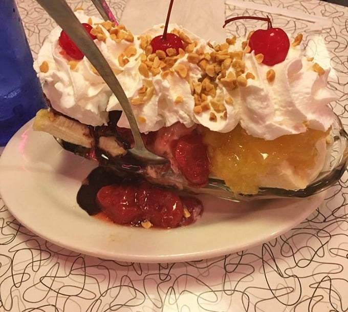 This banana split isn't just dessert—it's architecture, engineering, and art all in one glorious creation that dares you not to smile.