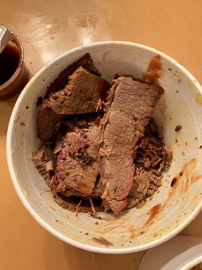 Behold the holy grail of barbecue—brisket with that perfect pink smoke ring. This isn't just meat; it's a time capsule of patience and expertise.