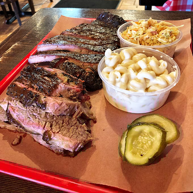 Behold the holy grail of barbecue—brisket with that coveted pink smoke ring and bark so beautiful it deserves its own art exhibition.