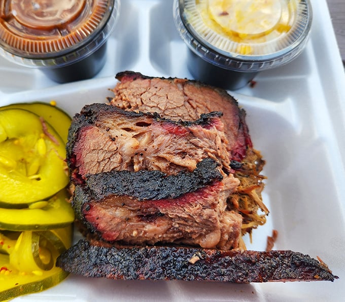 Brisket that doesn't need a filter—that smoke ring is the real deal, with a bark so perfect it deserves its own standing ovation.