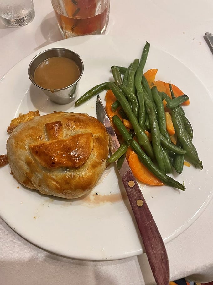 Beef Wellington done right—a golden pastry treasure chest protecting perfectly cooked beef. Worth every calorie.