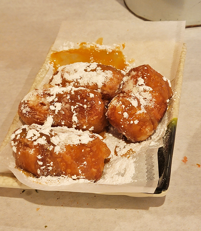 These beignets aren't just dessert—they're powdered sugar-dusted pillows of joy that would make New Orleans proud.